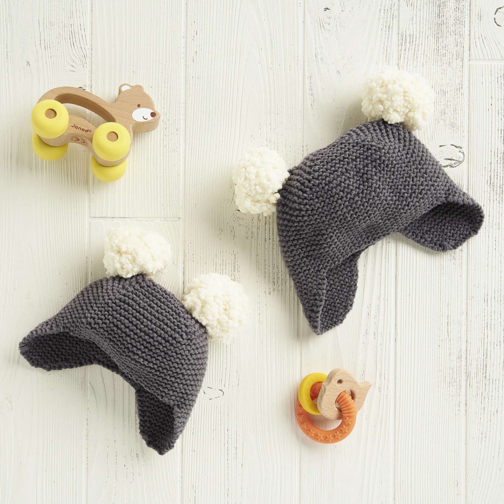 Free Easy Bernat Pom-a-thon Baby Hat Knitting Pattern | Yarnspirations