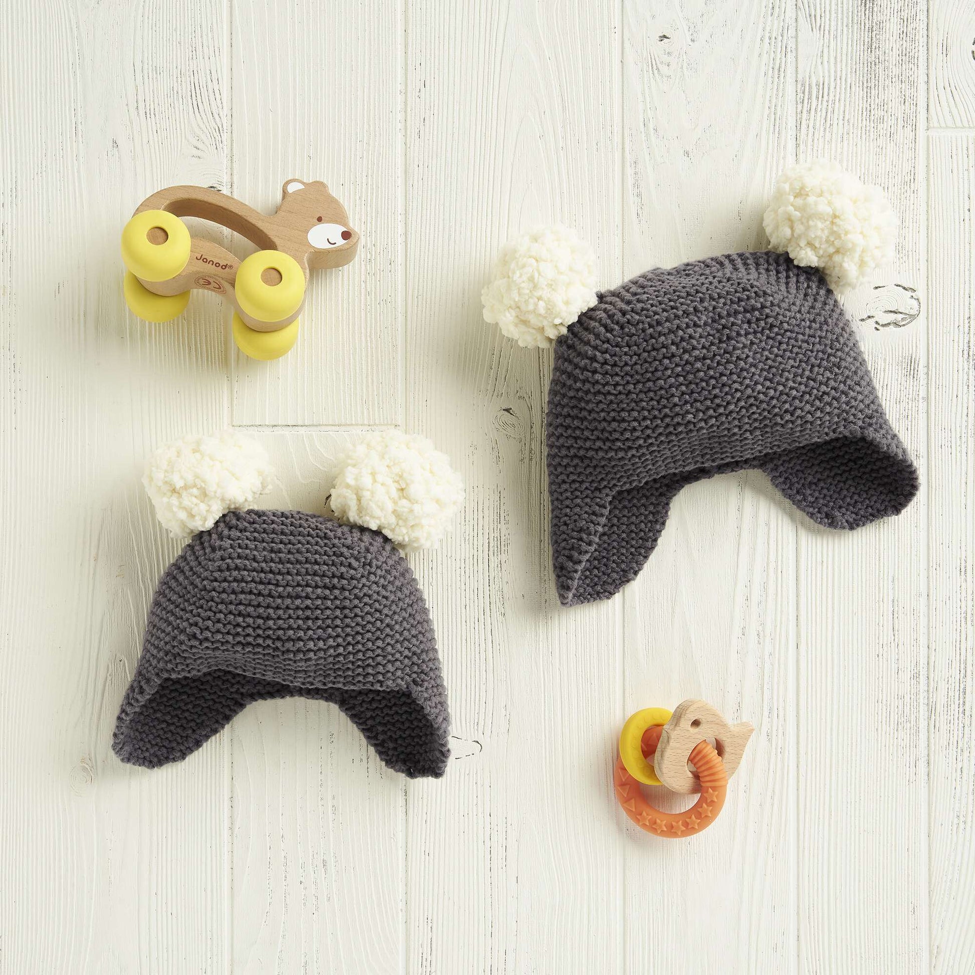 Free Easy Bernat Pom-a-thon Baby Hat Knitting Pattern | Yarnspirations