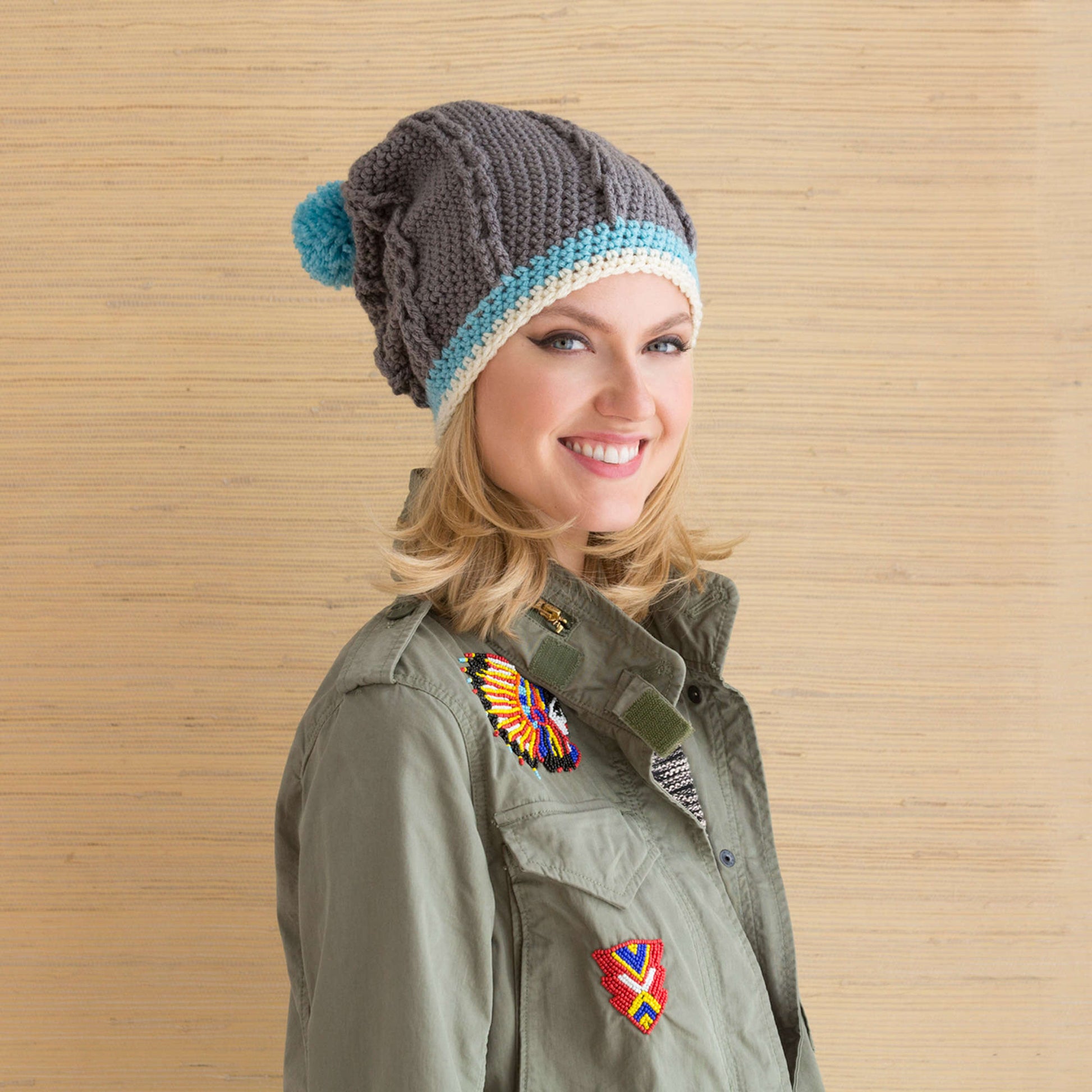 Red Heart Cabled Hat With Pompom | Yarnspirations