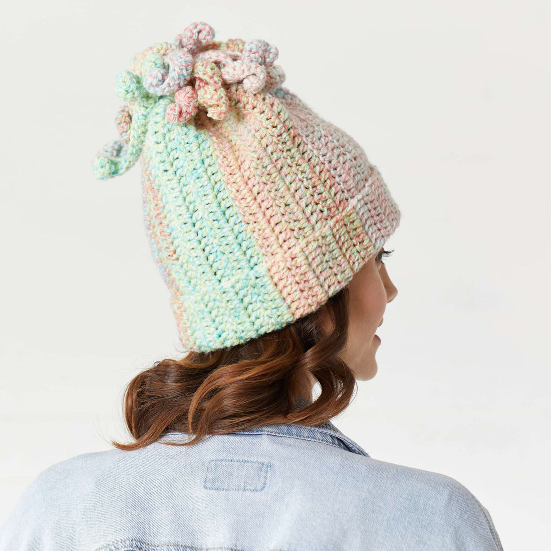 Free Easy Red Heart Tasseled Tube Hat Crochet Pattern | Yarnspirations