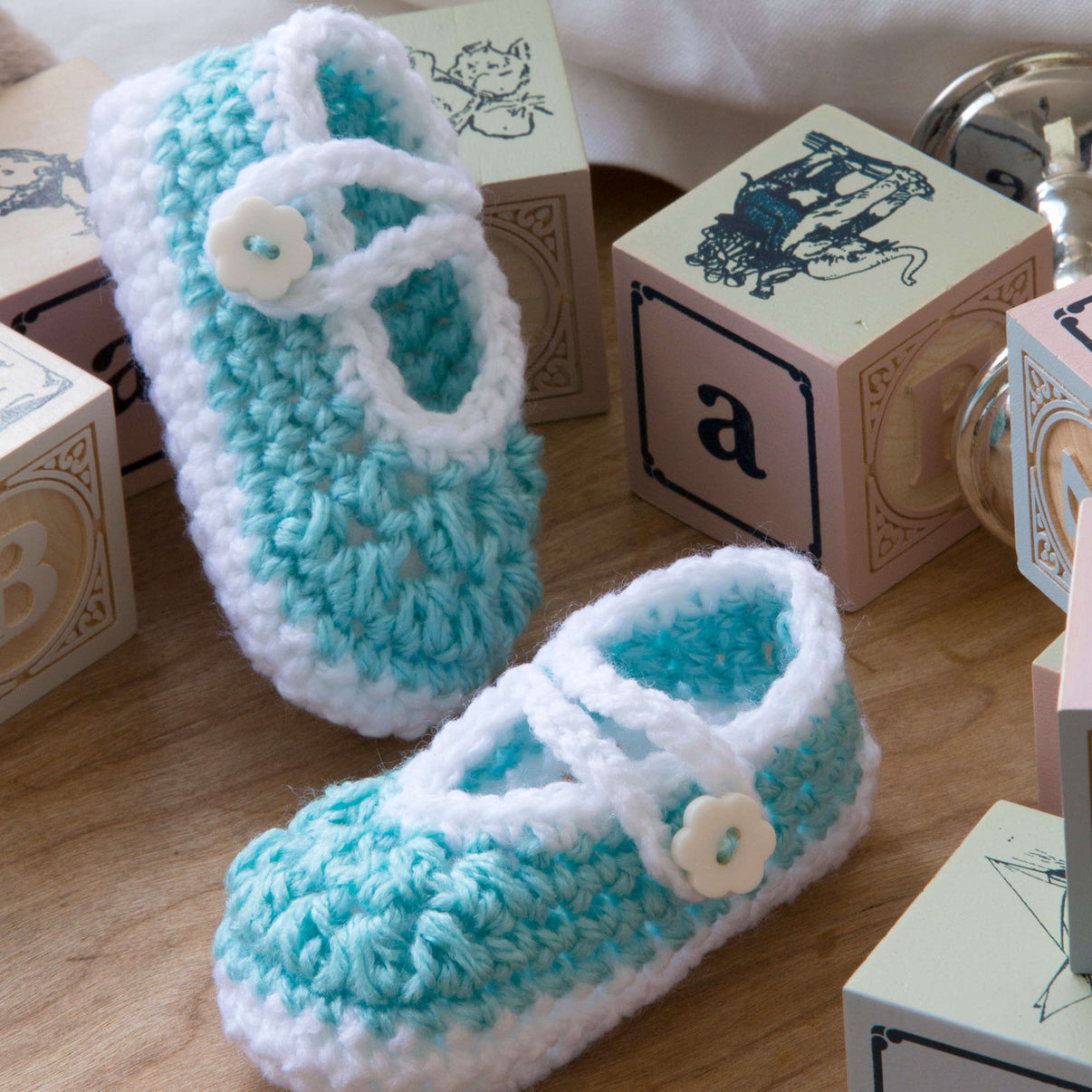 Red Heart Two-Color Baby Booties | Yarnspirations
