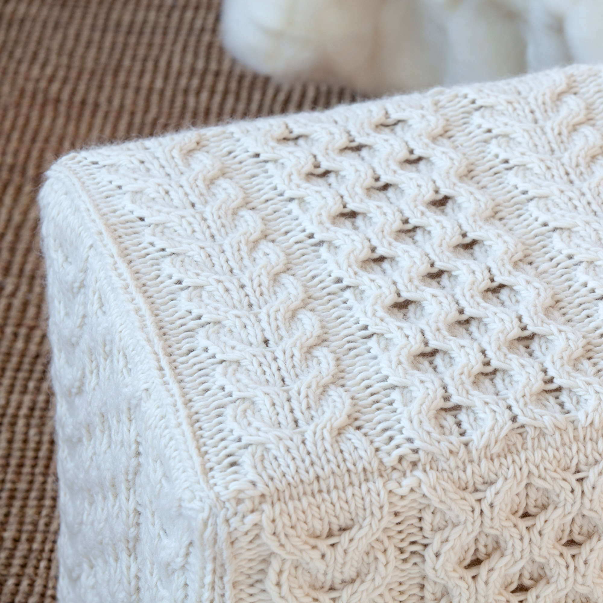 Free Red Heart Cabled Ottoman Cover Knitting Pattern | Yarnspirations