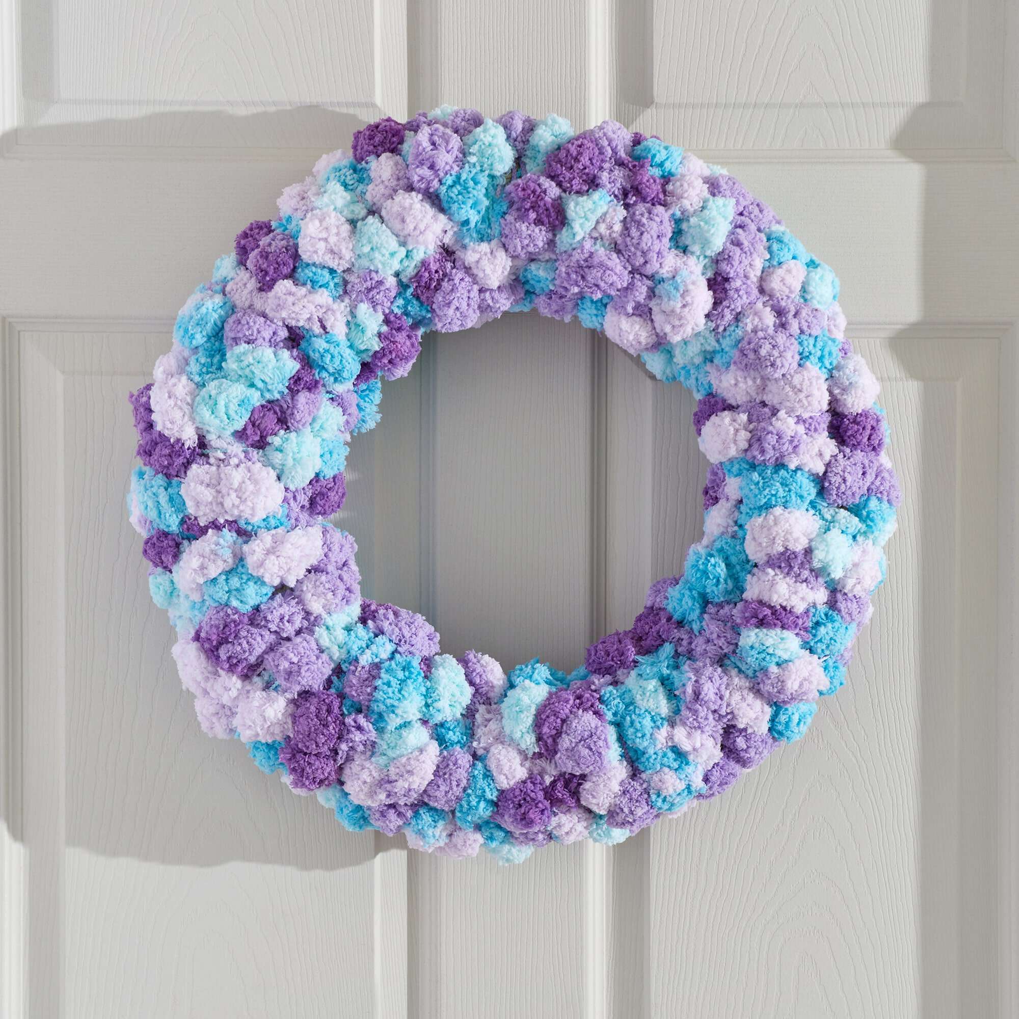 Free Beginner Red Heart Pomp-a-Doodle Wreath Craft Pattern | Yarnspirations